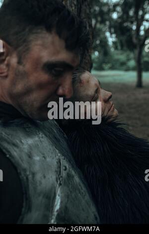 Two tired medieval warriors knights in chain mail armour rest among ...