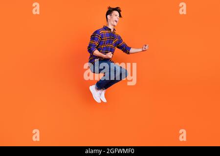 Full length photo of cheerful impressed guy dressed neon sweatshirt ...