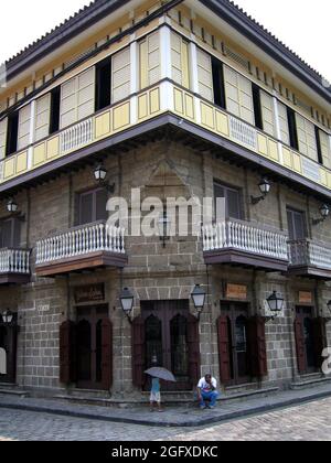 MANILA, PHILIPPINES - Apr 30, 2006: A narrow street scene with ...