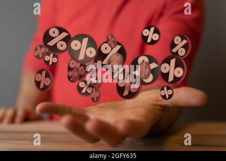 3D rendered percentage signs held in a person's hand Stock Photo - Alamy