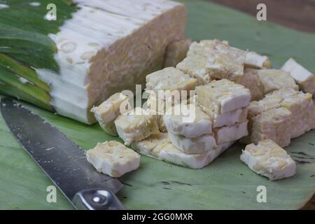 sliced fermented soy cake or tempeh for protein sources Stock Photo - Alamy