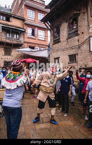 Nepalese youth plays traditional instruments during parade of Gai Jatra ...