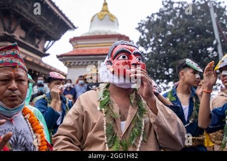 Nepalese youth plays traditional instruments during parade of Gai Jatra ...