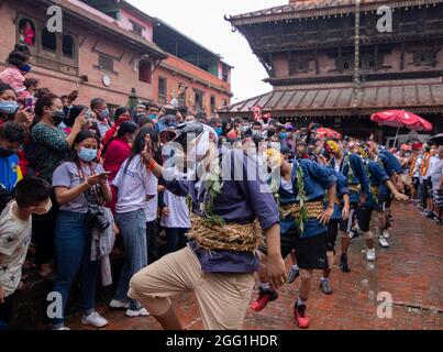 Nepalese youth plays traditional instruments during parade of Gai Jatra ...