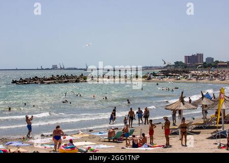 SATUR, ROMANIA - Aug 02, 2021: The tourists and sun lungers with ...