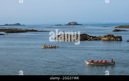 St Ayles' skiffs boats on beach in coastal rowing regatta, Firth of Forth, North Berwick, East ...