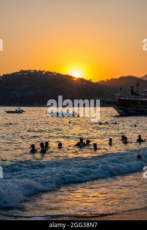 FETHIYE, MUGLA, TURKEY - August 21, 2021: Sunset view on OLUDENIZ ...