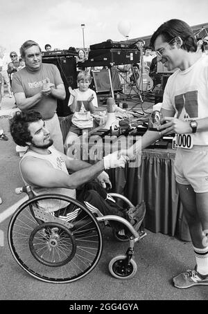 Austin Texas USA, 1990: Handicapped wheelchair athlete crosses finish ...