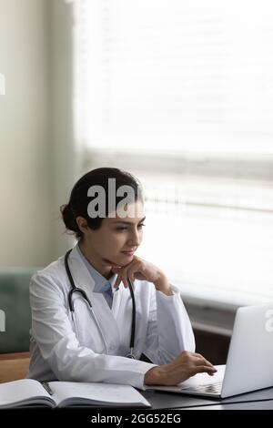 Young doctor cardiologist in telehealth concept Stock Photo - Alamy
