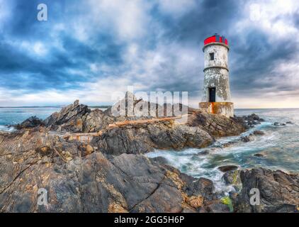 Gorgeous gloomy view of Capo Ferro Lighthouse. Popular travel ...