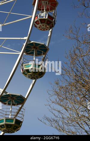 Big Wheel on Torquay seafront, seen between the towers of the Inner ...