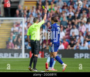 Referee Michael Oliver shows a yellow card to Spain's Lamine Yamal during the Nations League ...
