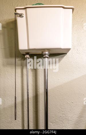 Porcelain toilet with pull chain to flush - path included Stock Photo ...