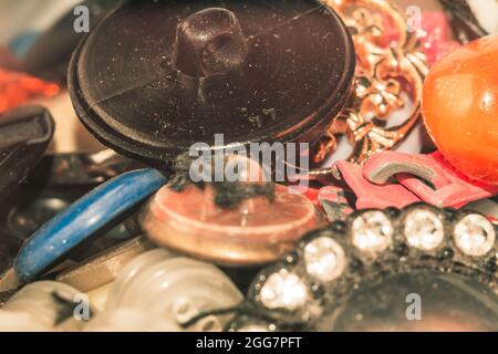 A selective shot of mix of cloth buttons of different color and size ...