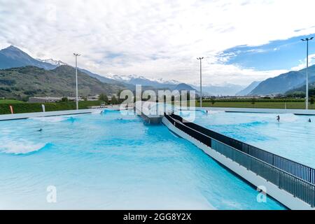 Surf wave pool in Switzerland. Alaia bay and Wave Garden in Sion ...