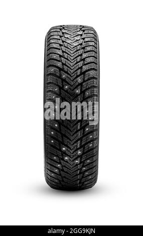 winter studded tire front view close-up on a black background tread ...