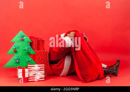 Unknown man with wearing santa claus costume and red hat, standing ...