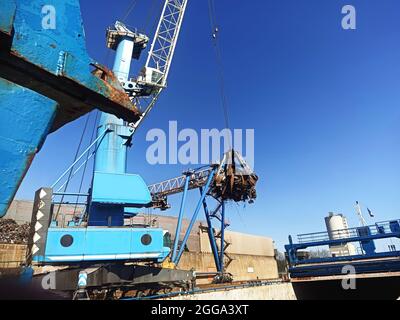 loading and unloading of scrap metal in the port on the berth from the ...