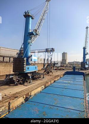 loading and unloading of scrap metal in the port on the berth from the ...