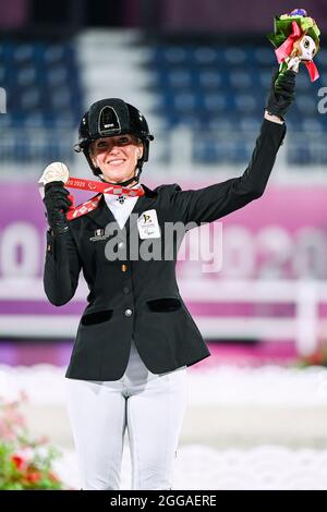 Belgian Paralympic jockey Manon Claeys celebrates on the podium after ...
