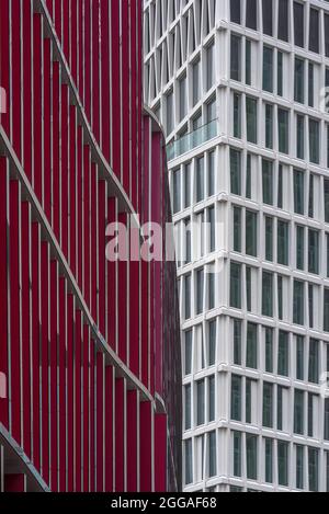 Modern city skyline with high rise buildings and a coastal promenade ...