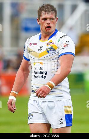 Tom Holroyd #18 of Leeds Rhinos celebrates his try and makes the score ...