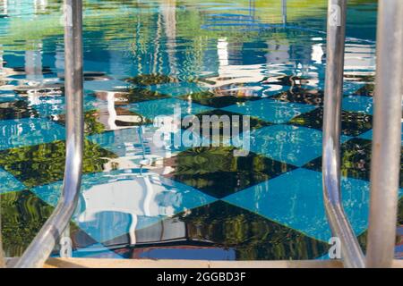 Swimming pool with diamond shaped tiles Stock Photo - Alamy