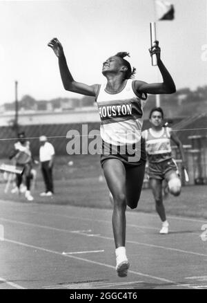 Winning the 1600 meter relay in a high school track meet Stock Photo ...