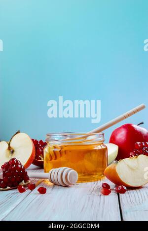 Jewish holiday Rosh Hashanah background with honey and apples on wooden ...