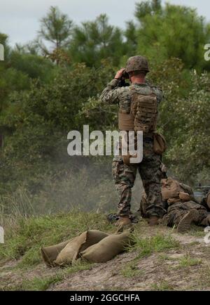 U.S. Marines with the Advanced Infantry Unit Leaders Course exit a SH ...