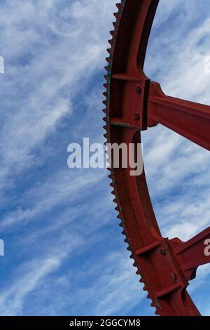 Giant cog wheel, a relic of mining days, west coast, New Zealand Stock ...