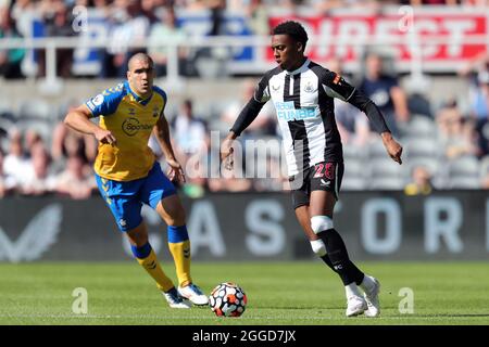 Joe Willock #28 of Newcastle United sits on the pitch after the full ...