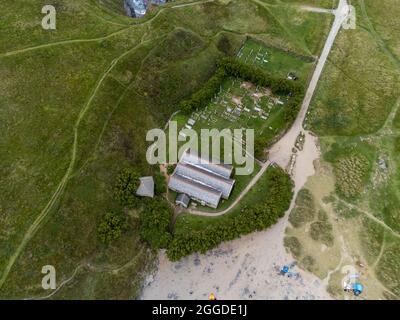 aerial drone around church cove and mullion golf course cornwall uk ...