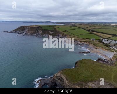 aerial drone around church cove and mullion golf course cornwall uk ...