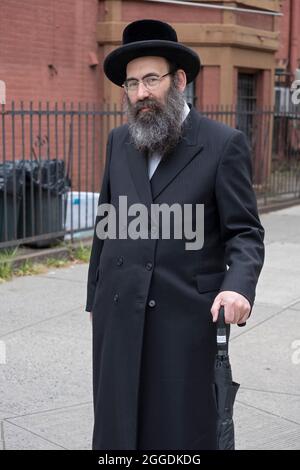 posed portrait of a middle aged jewish man wearing long white socks & a ...