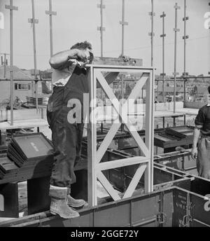A man fixing the shuttering for the construction of Easiform housing in ...