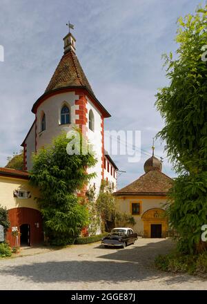 Church on the right and forecourt with vintage Opel Kapitaen, built ...