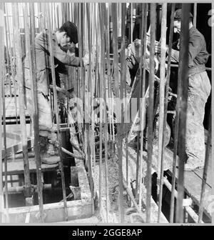 Work industrial concept : Pouring concrete into steel box for ...