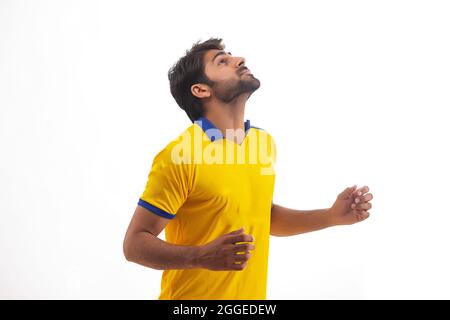 A FOOTBALL PLAYER LOOKING ABOVE WHILE PRACTICING Stock Photo - Alamy