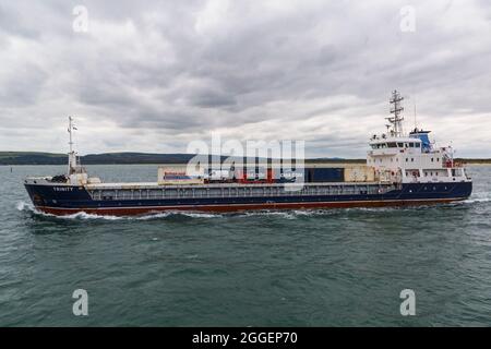 Trinity general cargo ship underway departing from Poole Harbour ...