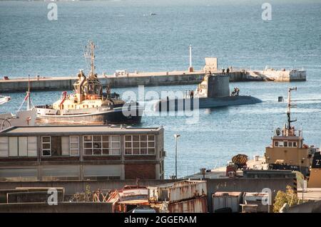 SA Navy Submarine docking with tugboats in attendance Stock Photo - Alamy