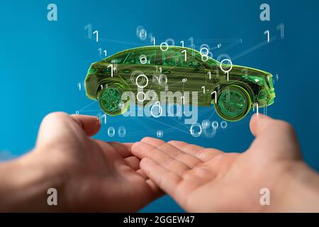 A 3D rendered hologram of a car and binary code hovering over a man's ...