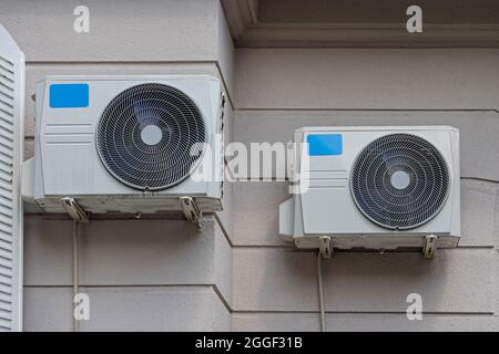 Two Big Air Conditioner Units at House Exterior Wall Stock Photo - Alamy
