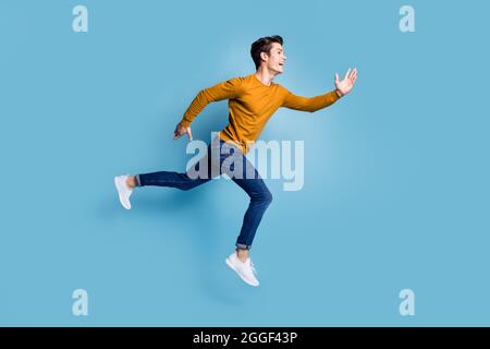 Full length profile photo of sportive charming person running jump ...