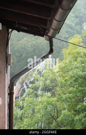 Closeup of a house downpipe during rain Stock Photo - Alamy