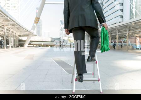 Young desperate businessman with suicide rope concept Stock Photo - Alamy