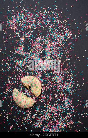 Prepared dry biscuits with sugar grains of different colors Stock Photo ...