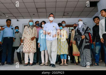 Bangladeshi American Sharif Imran and his two Japanese daughters coming ...