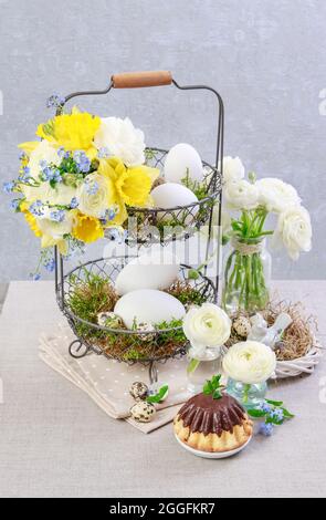 easter arrangement with easter goose and blue spring flowers Stock ...