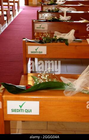 Church pews with signs of social distancing notices due to the Covid-19 ...